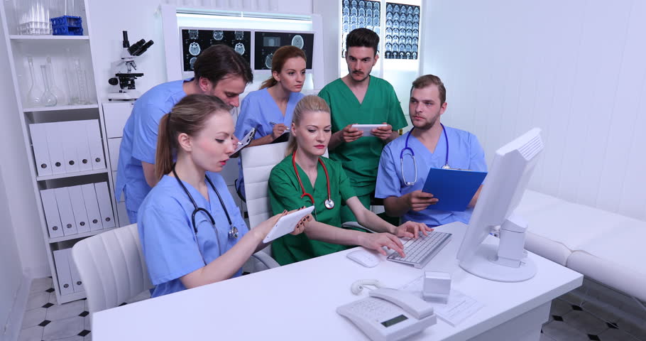 Busy Medical Team Of Doctors Talk Positive Cooperation Hospital Room ...