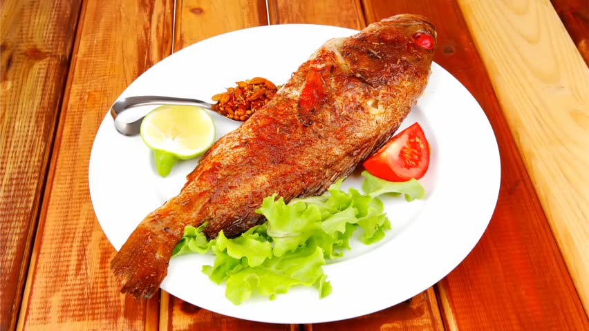 Main Course : Roasted Sea Fish On Plate With Tomatoes Lemon And Spices ...
