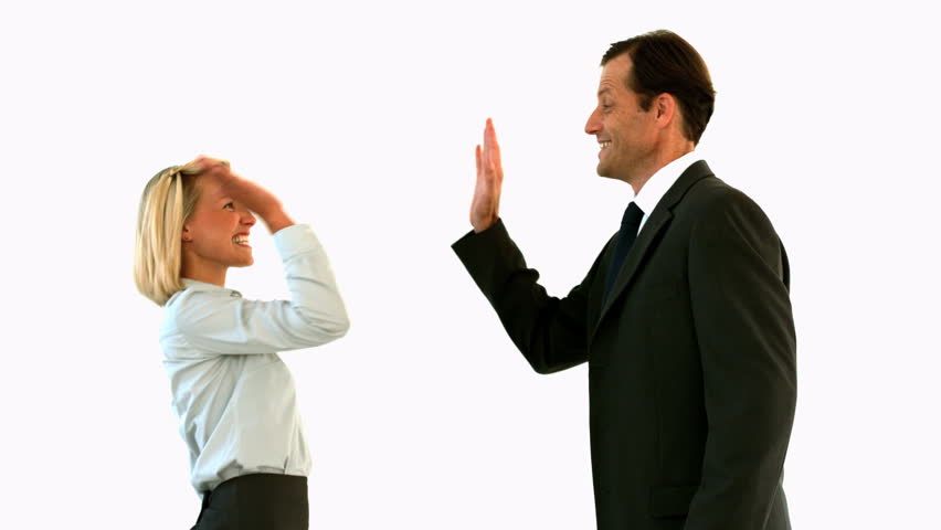 Two Men Giving Each Other A High-five In Slow Motion Against A White ...