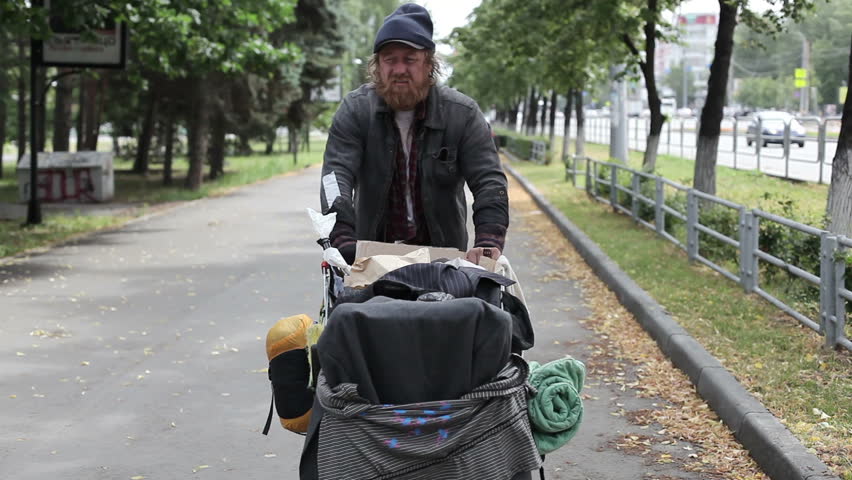 Stock video of homeless man driving the cart with | 4349405 | Shutterstock