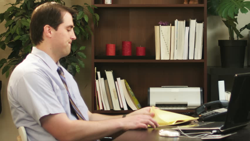 An Angry Businessman Is Fed Up With His Computer So He Begins Hitting ...