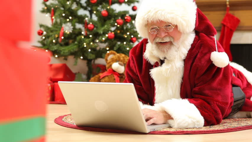 Stock Video Clip of Santa Claus typing on laptop computer | Shutterstock
