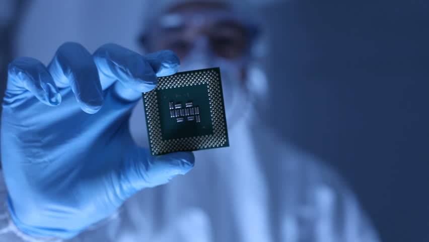 Man in clean room holds up computer 的库存视频影片 | Shutterstock