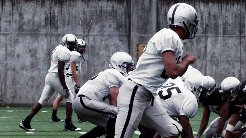 A Quarterback Hikes the Ball Stock Footage Video (100% Royalty-free ...