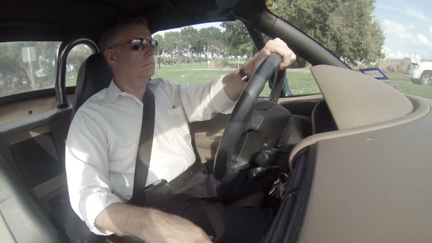 View From Inside A Sports Car To A Mature Man Driving Home After A Day ...