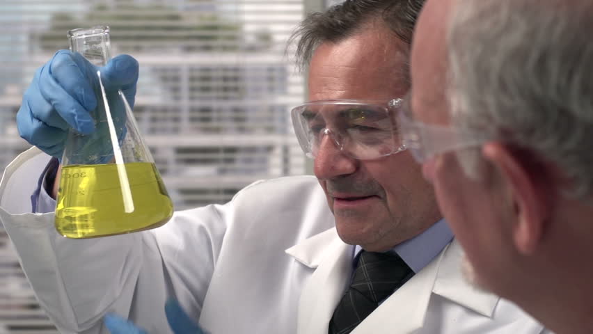 Stock video of two male scientists looking at a | 5146535 | Shutterstock