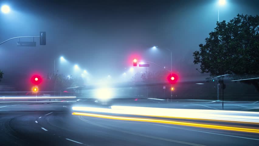 4K. Street Intersection Traffic At Foggy Night In Los Angeles ...
