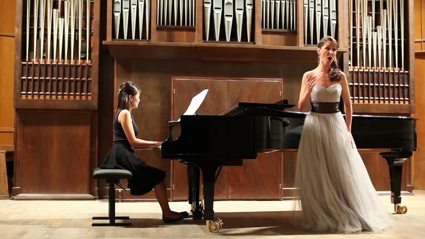 Graceful Woman Pianist And Opera Singer Finishes The Performance At ...