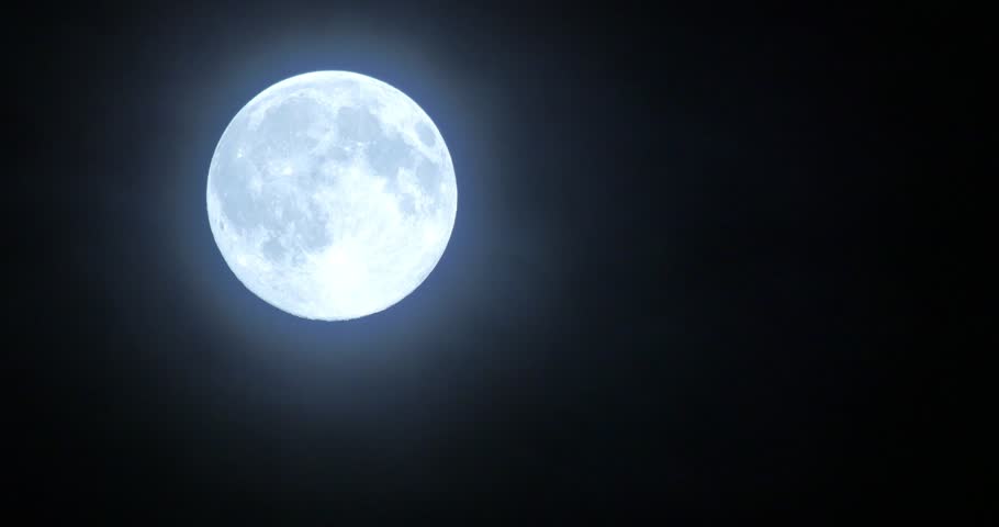 Stock Video Clip of Beautiful full moon shining through moving blue ...