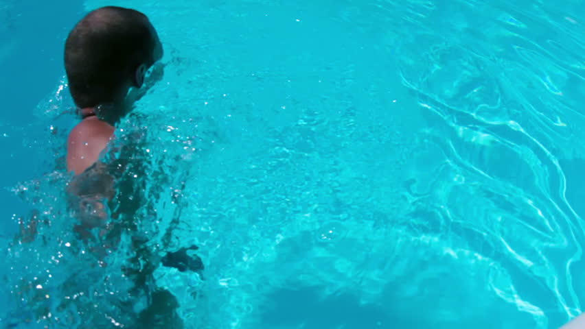 Sexy Blonde In Blue Bikini Diving Into The Swimming Pool On A Sunny Day ...
