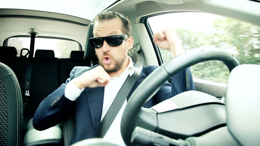 Business Man With Sun Glasses Driving Car Dancing Happy Stock Footage ...