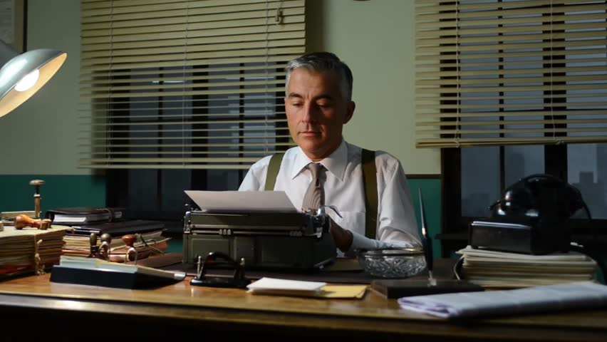 Confident 1950s Reporter Typing With Typewriter At Office Desk Late At ...