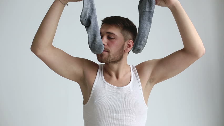 Stock video of man is smelling his socks | 8058985 | Shutterstock