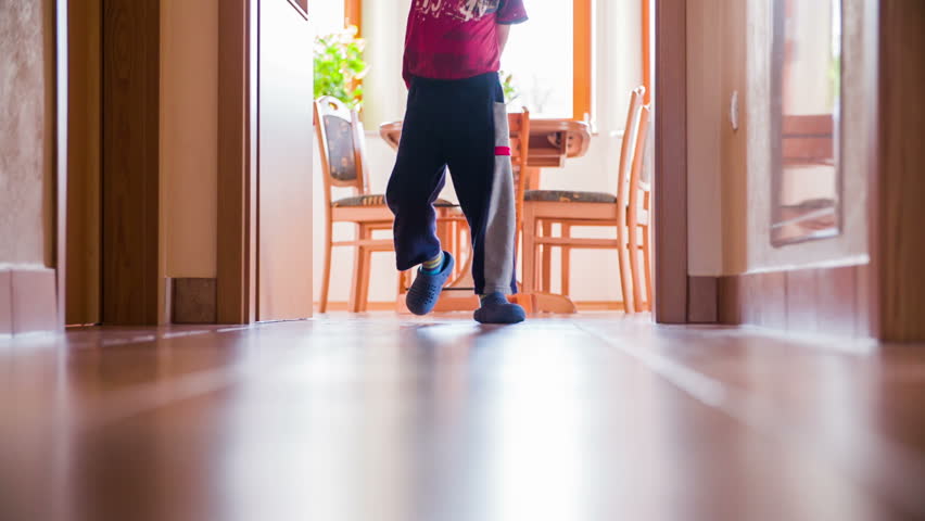 Boy Run In To A Room At Home In Slow Motion. Young Kid At Home Running ...