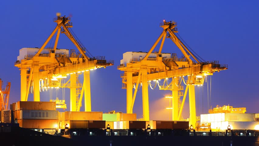 Container Cargo Freight Ship With Working Crane Bridge In Shipyard At ...