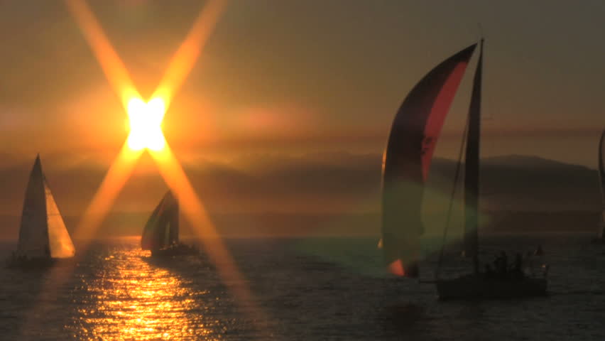 Sailboats Cross the Setting Sun Stock Footage Video (100% Royalty-free ...