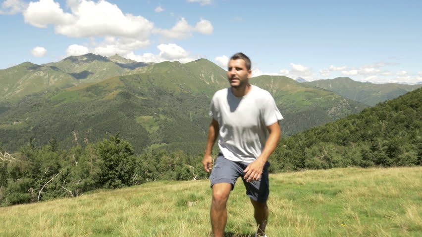 Back And Side View Of Young Man Hiking In Mountain Outdoor Nature ...