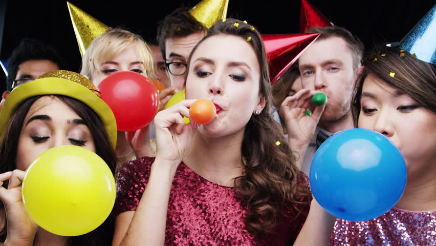 Stock video of multi racial group of friends blowing | 8870695 ...