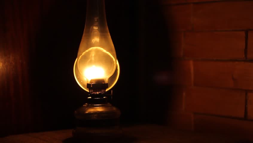In A Dark Room, A Person Makes More Light Using The Old Gas Lamp ...