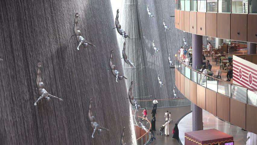 DUBAI, UAE - 20 JANUARY 2015: Statues Seem To Dive In Front Of A ...