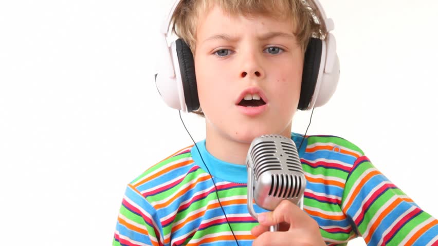Stock Video Clip of boy in earphones talking through microphone on ...