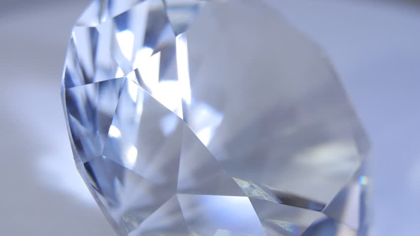 Facets Of A Diamond Sparkle The Bright Light. Move Camera Above The ...
